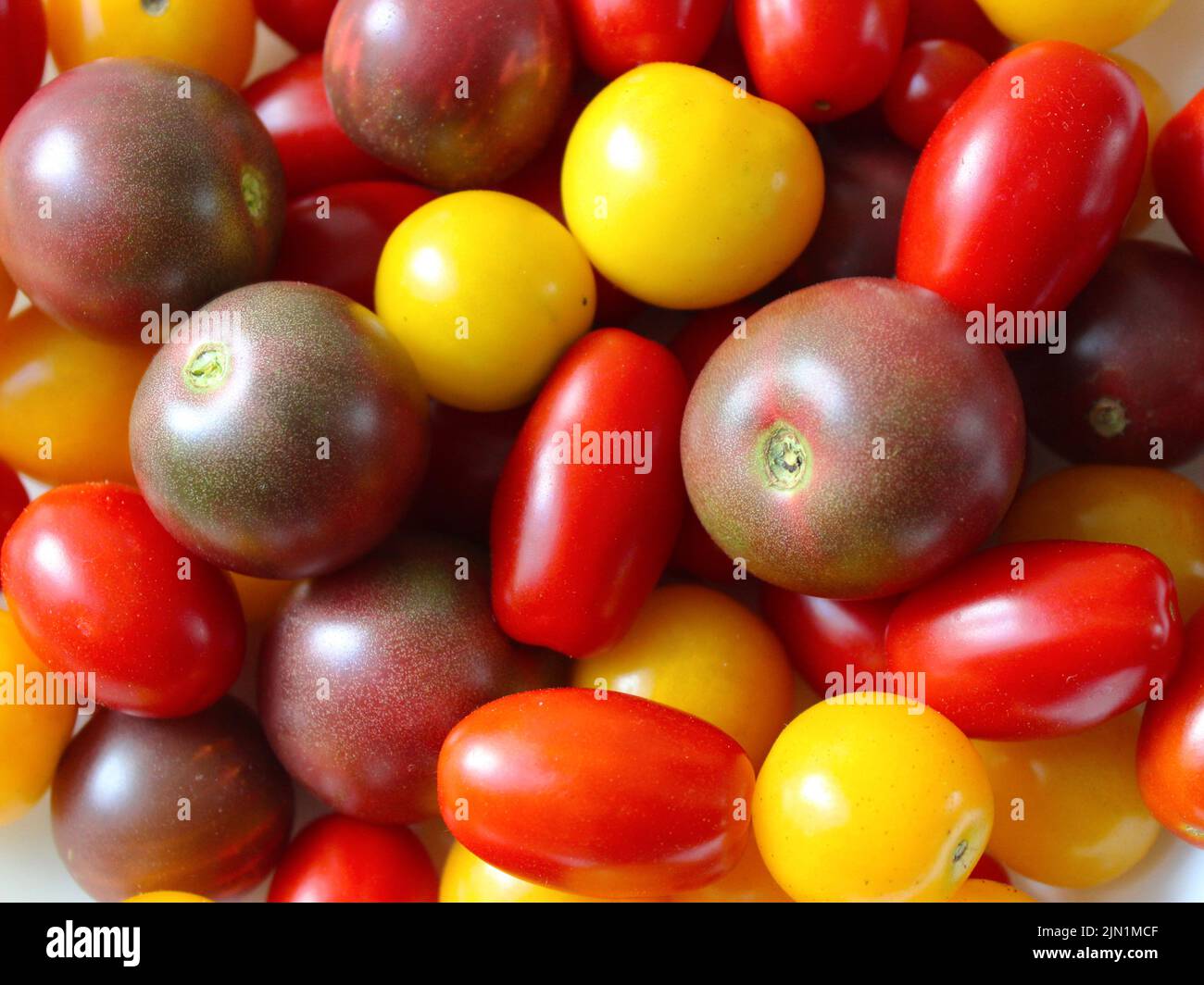 A Pile of Colorful Cherry and Grape Tomatoes Stock Photo - Alamy