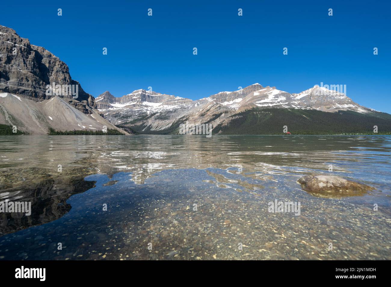 Calm water of Bow Lake in Banff National Park, along the Icefields ...