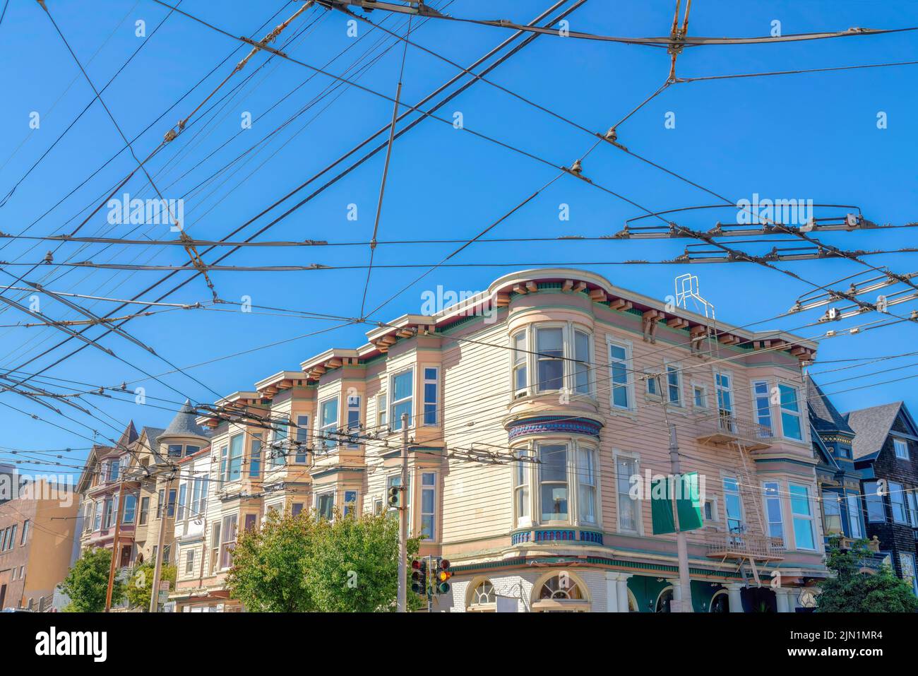 Cable car trolley electric wires at the front of residential buildings ...