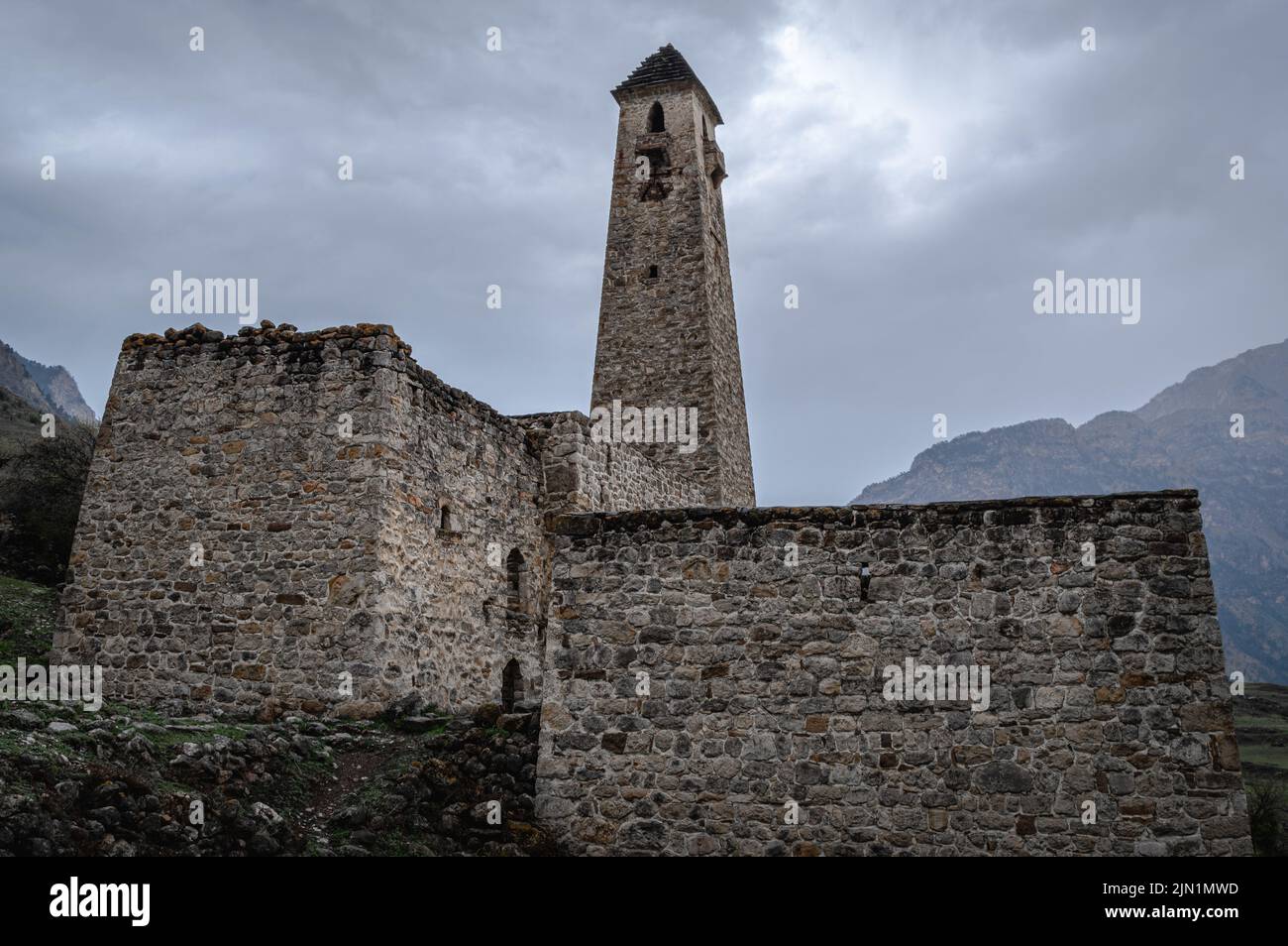 Medieval Tower Complex Egikal against cloudy skies, Ingushetia Stock ...