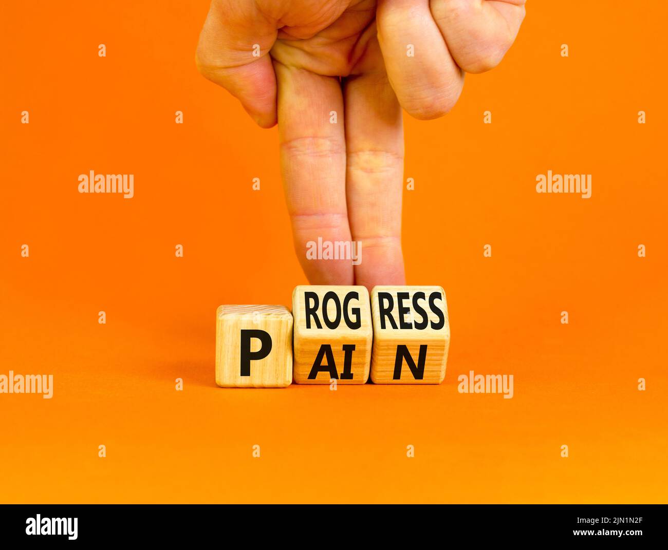 Pain or progress symbol. Concept words Pain or Progress on wooden cubes ...