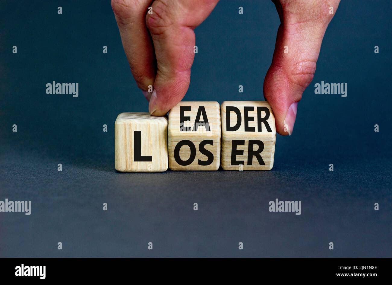 Loser or leader symbol. Concept words Loser or leader on wooden cubes ...