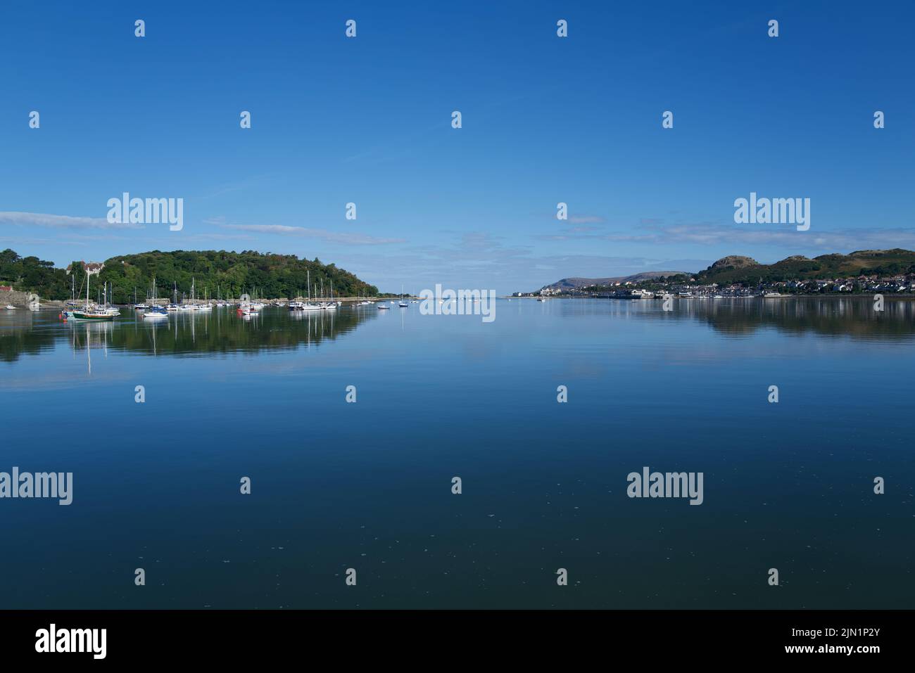 The magnificent Conwy Estuary stretches between Deganwy Castle and ...