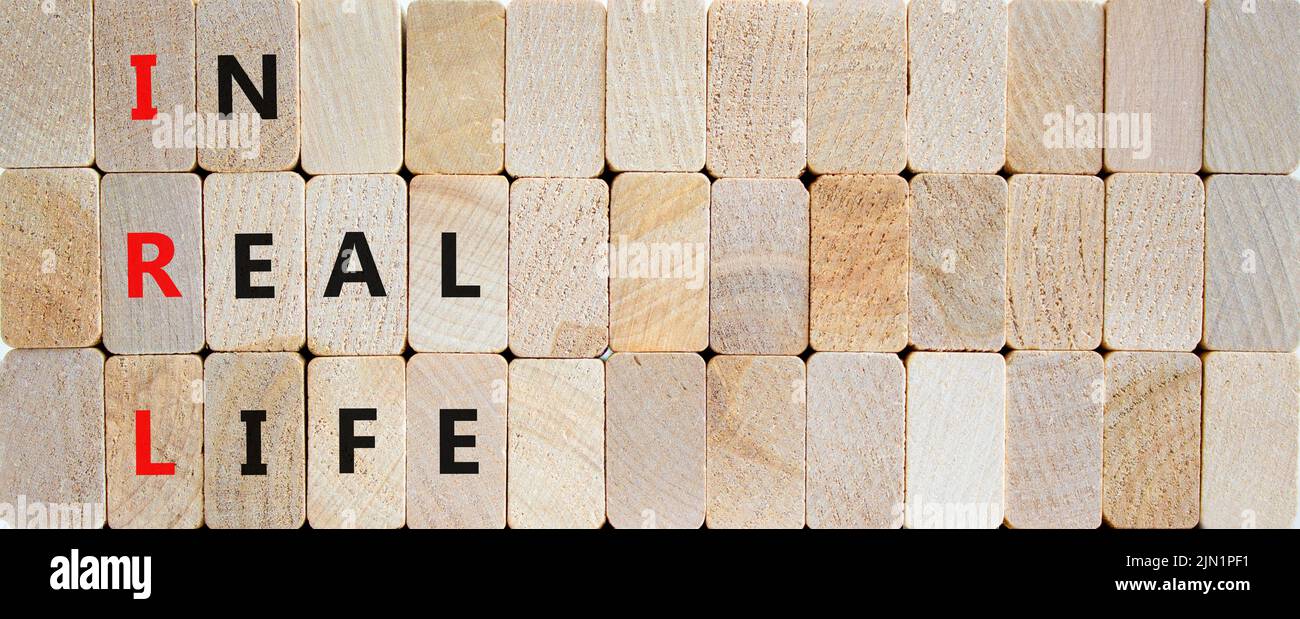 IRL in real life symbol. Concept words IRL in real life on wooden ...