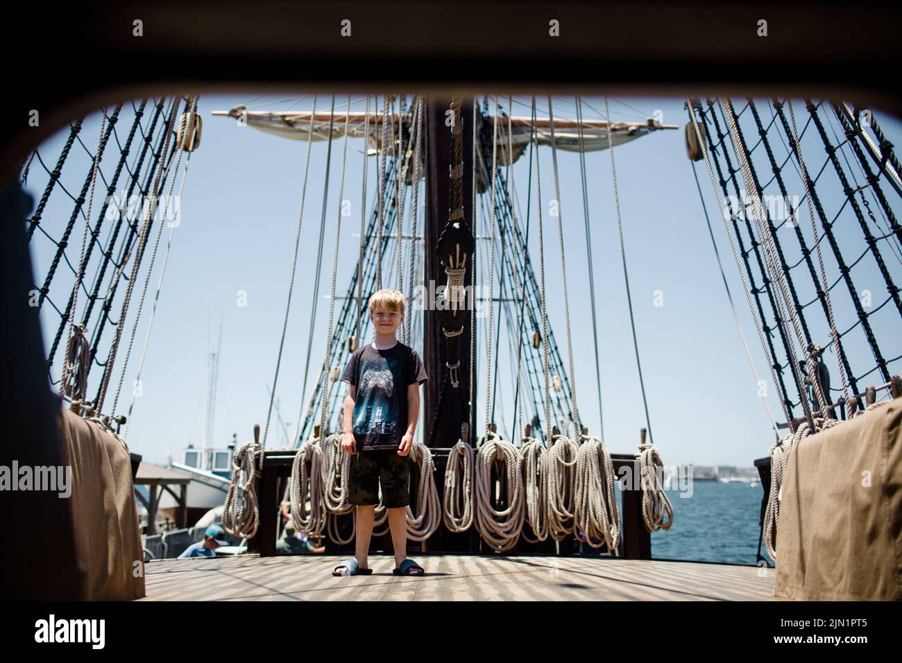 Eight Year Old Boy Posing on Sailboat at Maritime Museum in San Diego ... Eight Year Old Boy Posing on Sailboat at Maritime Museum in San Diego ...