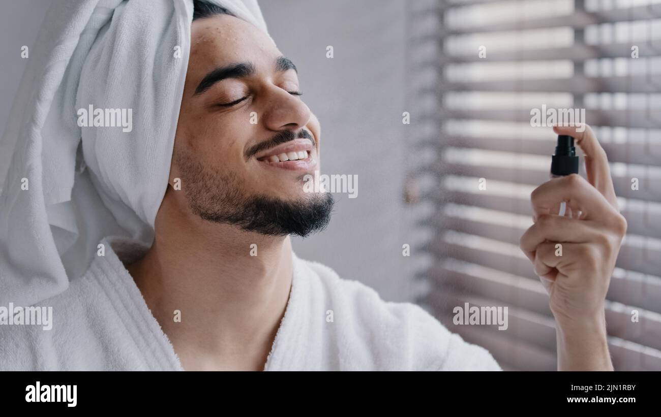 Funny Hispanic bearded Indian man with white bath towel on head in ...