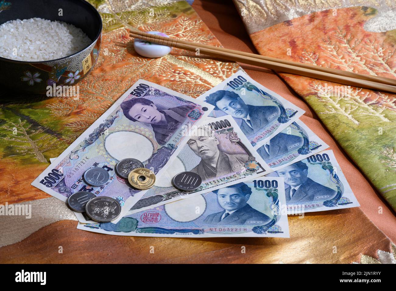 Coins and paper banknotes of Japanese yen on the background of national ...