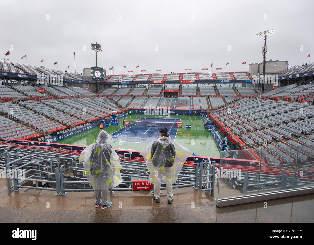 August 8, 2022, Montreal, PQ, Canada: Volunteers wear rain jackets as ...