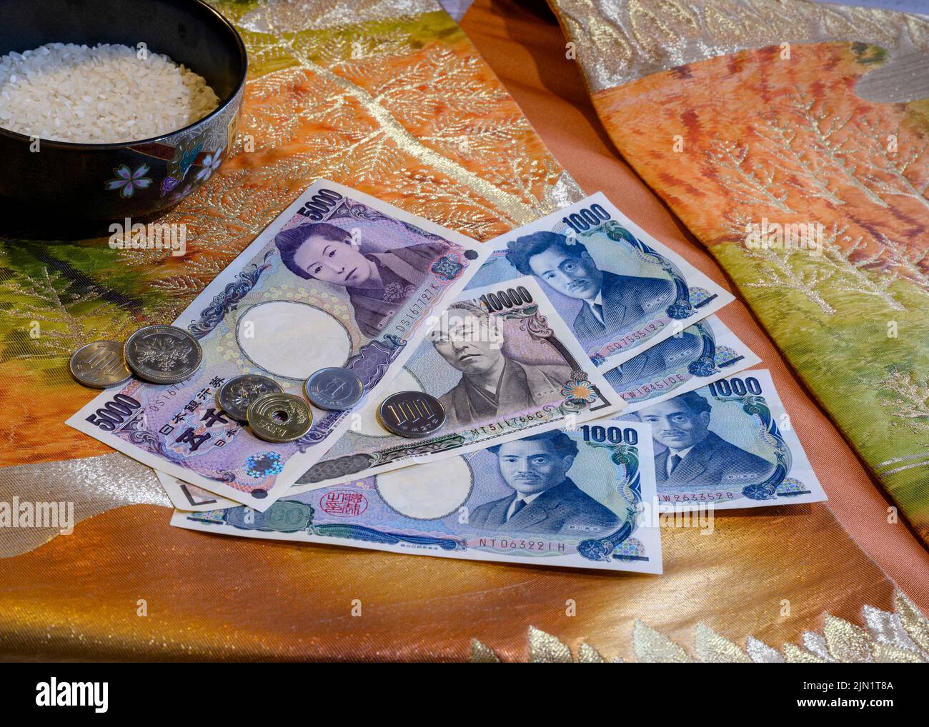 Coins and paper banknotes of Japanese yen on the background of national ...