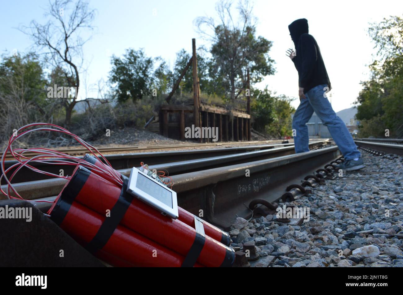 Terrorist placing a time bomb Stock Photo - Alamy
