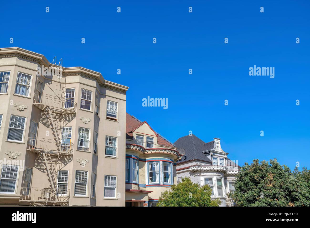Beige apartment building with emergency stairs beside the victorian ...