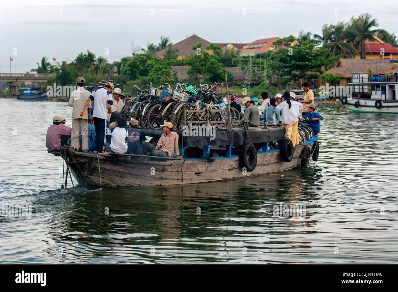 Ferry in Hoi An taking workers and cycles home at the end of the day ...