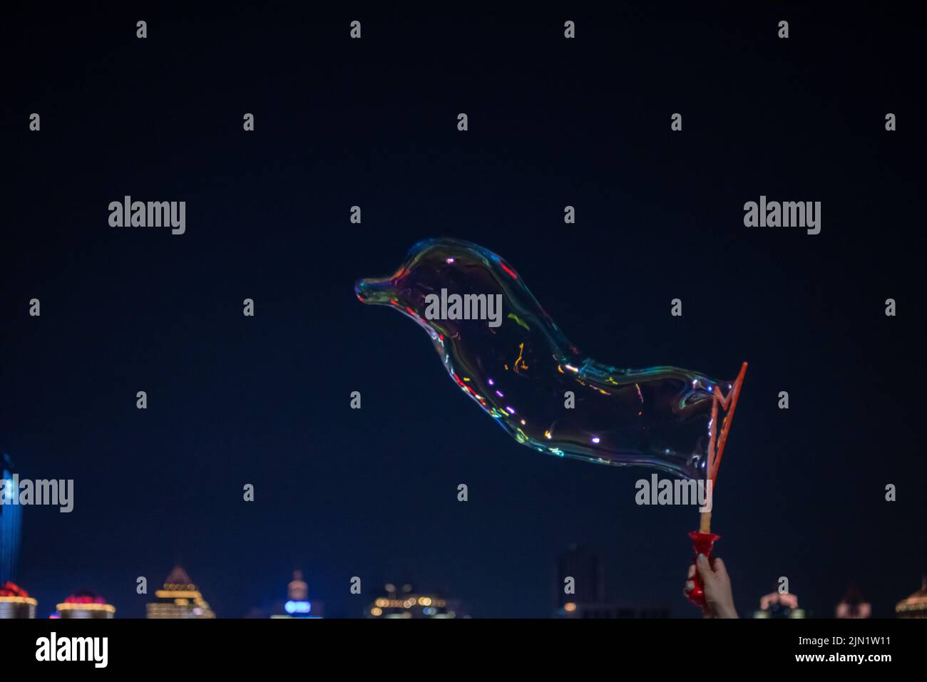 Giant Bubble in the form of a dolphin on the backgroundin the Sky ...