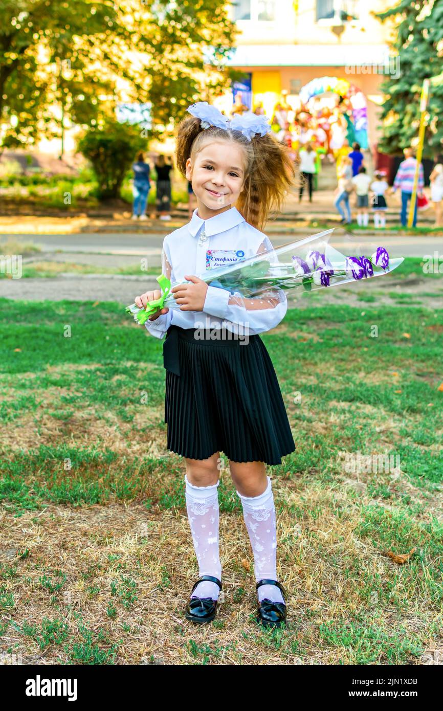 Lysychansk, Ukraine. September 1, 2021 - a girl with a bouquet of ...