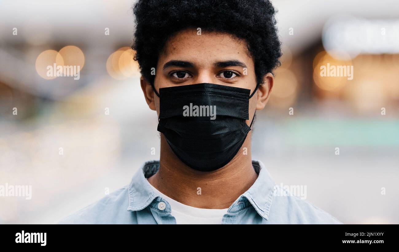 Portrait male masked face african american guy man taking off medical ...