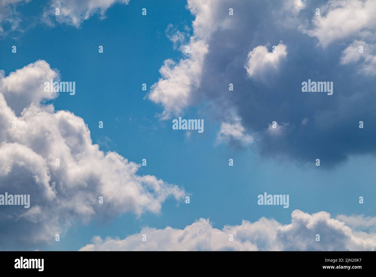 Fluffy white high clouds on bright blue sky, cloudscape background ...