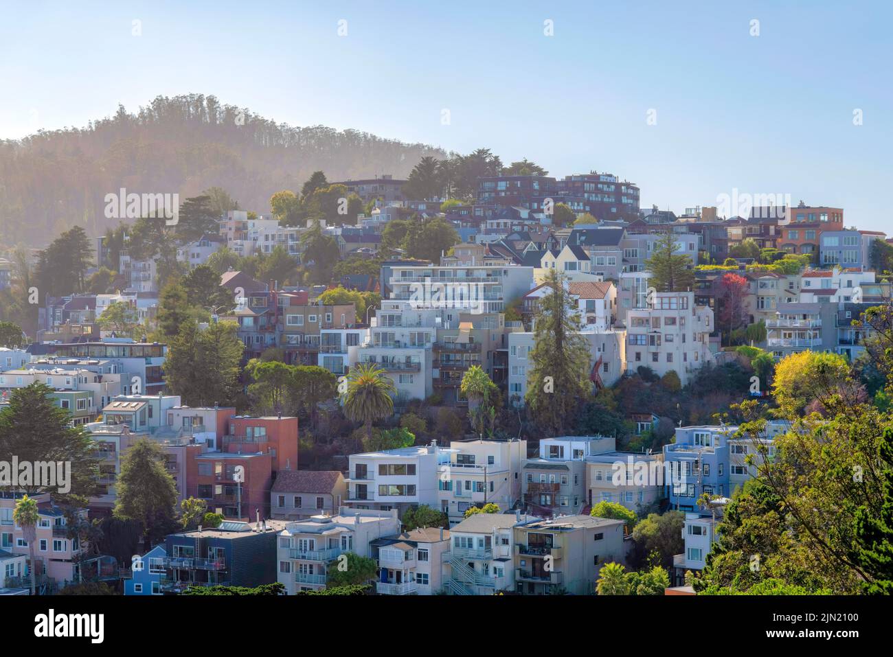 Modern residential buildings on a mountain against the faint skyline at ...