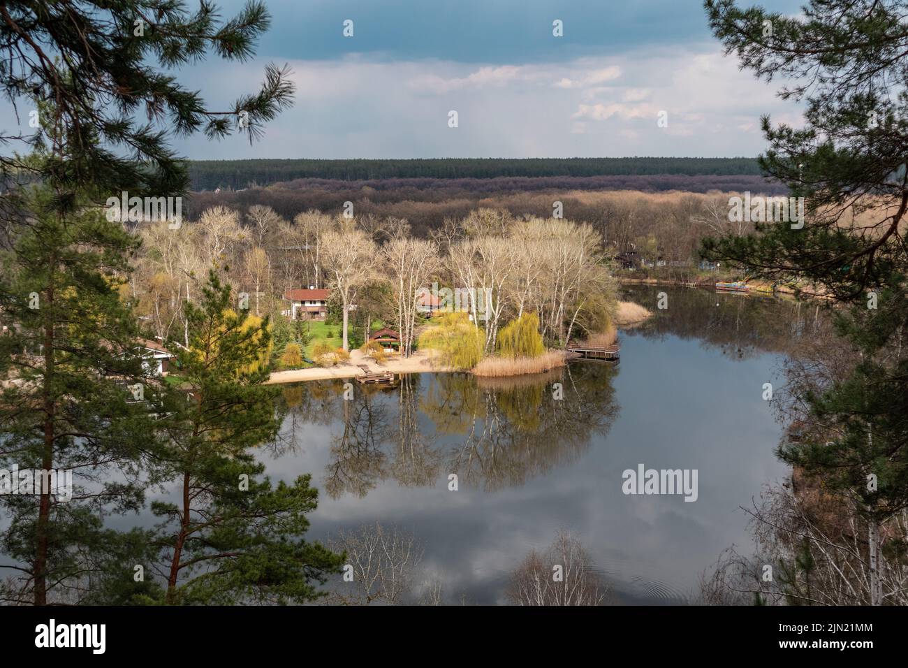Spring sunny river with recreation area and forest. Cossack mountain ...