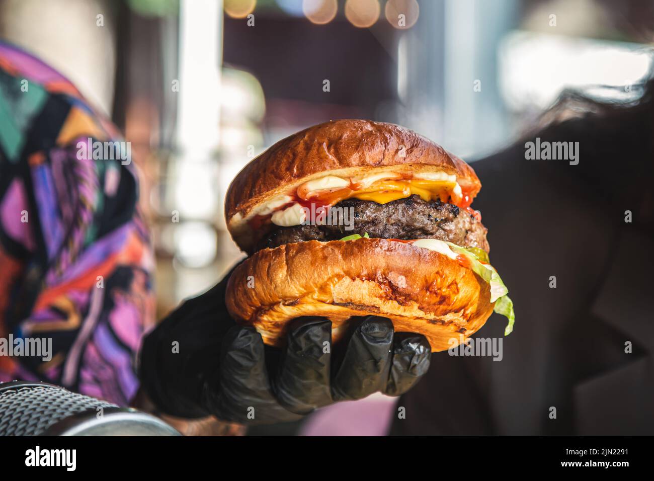 Woman big appetite eating hamburger hi-res stock photography and images ...