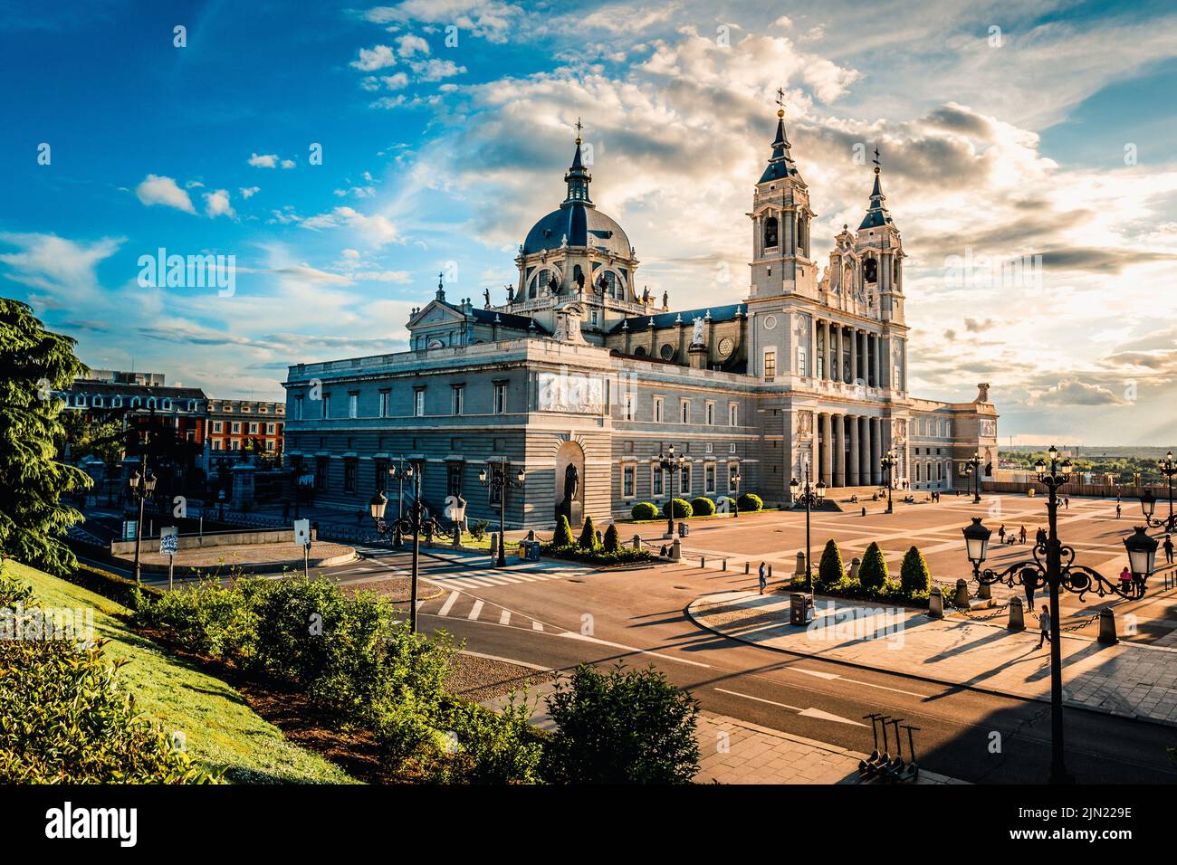 An aerial view of Almudena cathedral under blue bright sky in Madrid ...