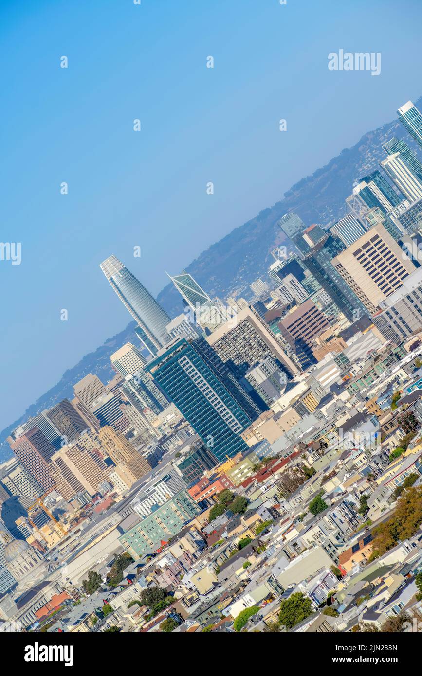 Canted shot of downtown against the mountain and sky San Francisco ...