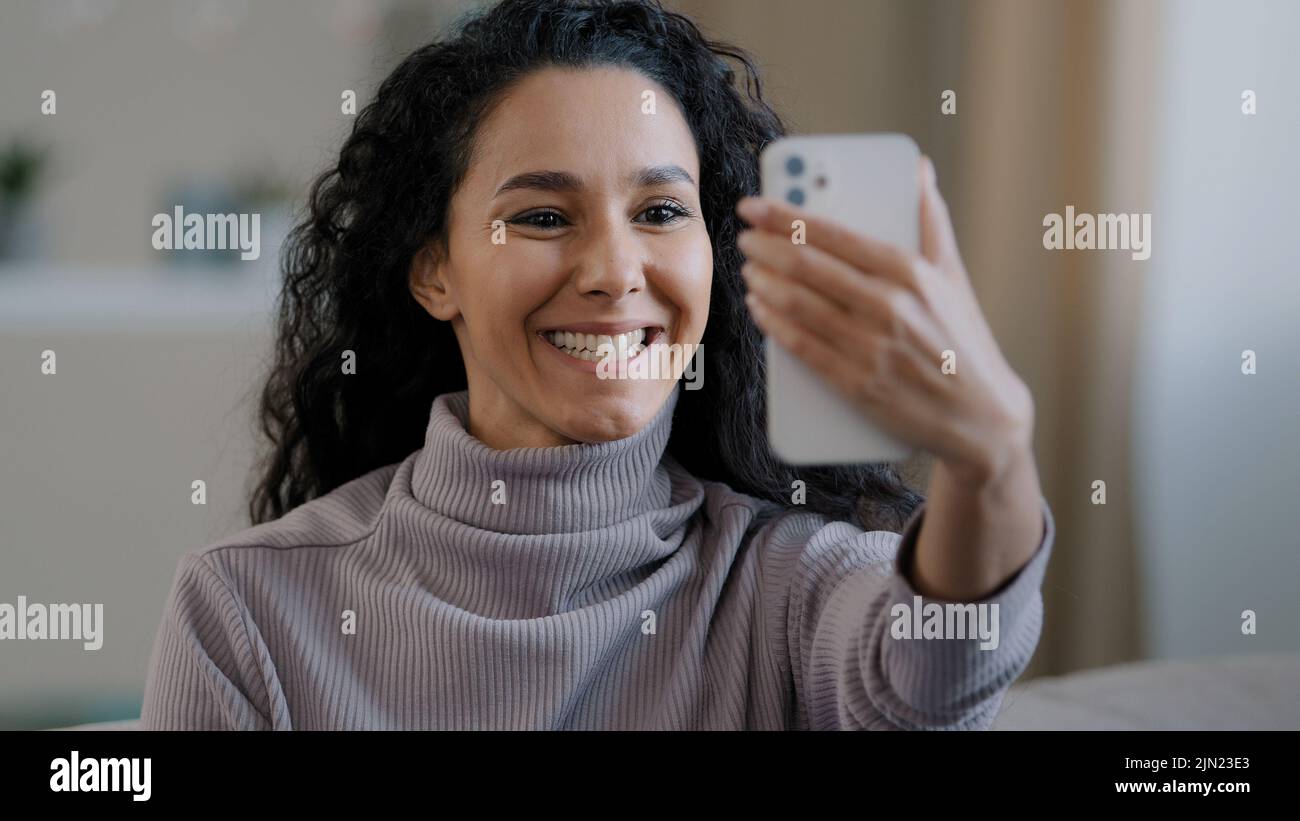 Excited young beautiful woman making video call using phone enjoy ...