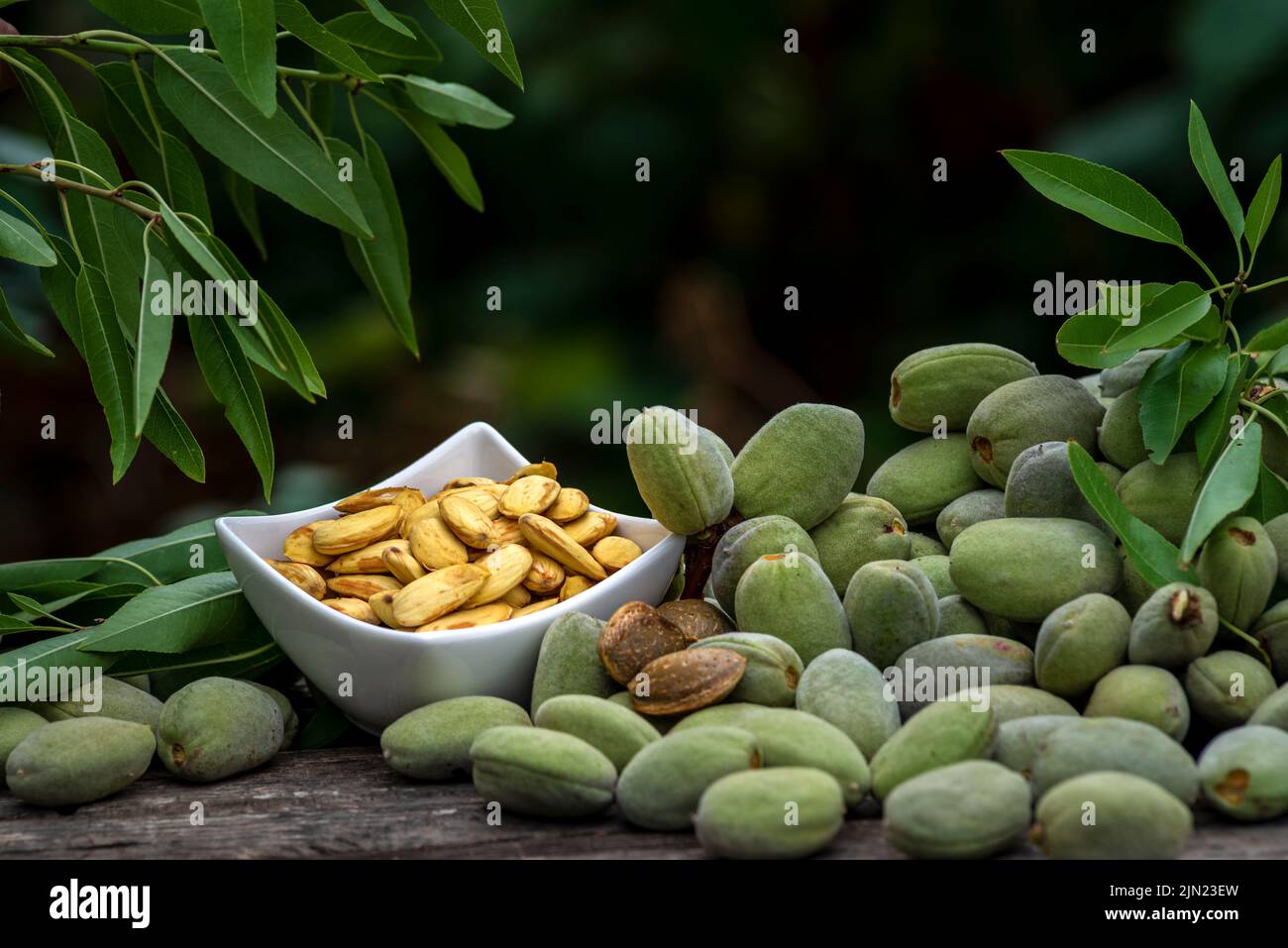 Green almonds background fresh raw unripe wooden rustic table blurred ...