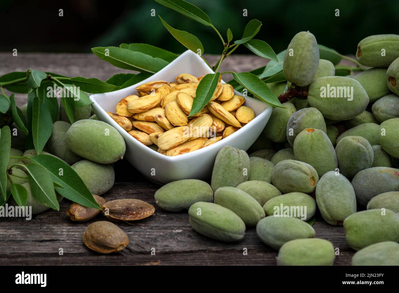 Green almonds background fresh raw unripe wooden rustic table blurred ...