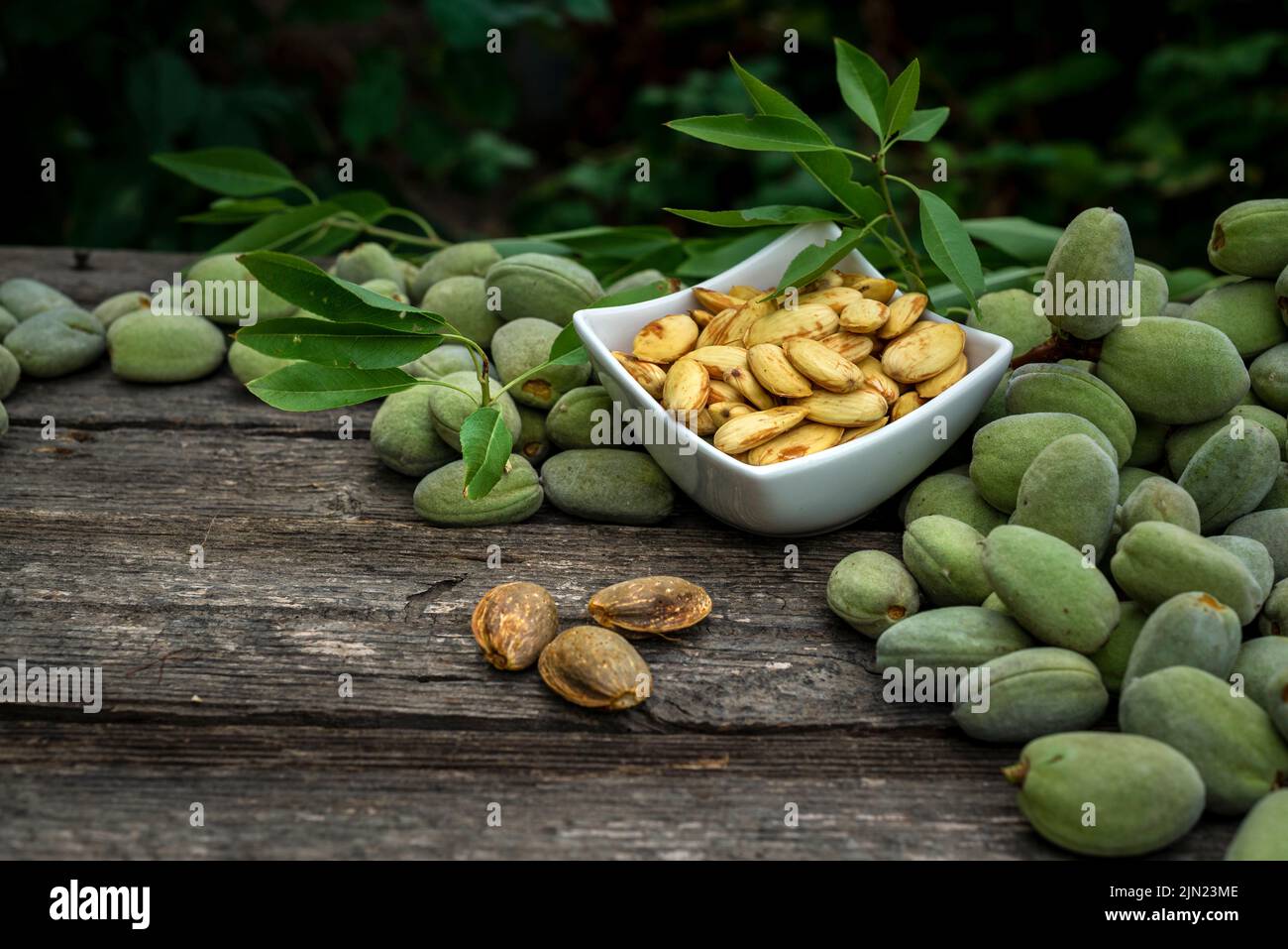 Green almonds background fresh raw unripe wooden rustic table blurred ...