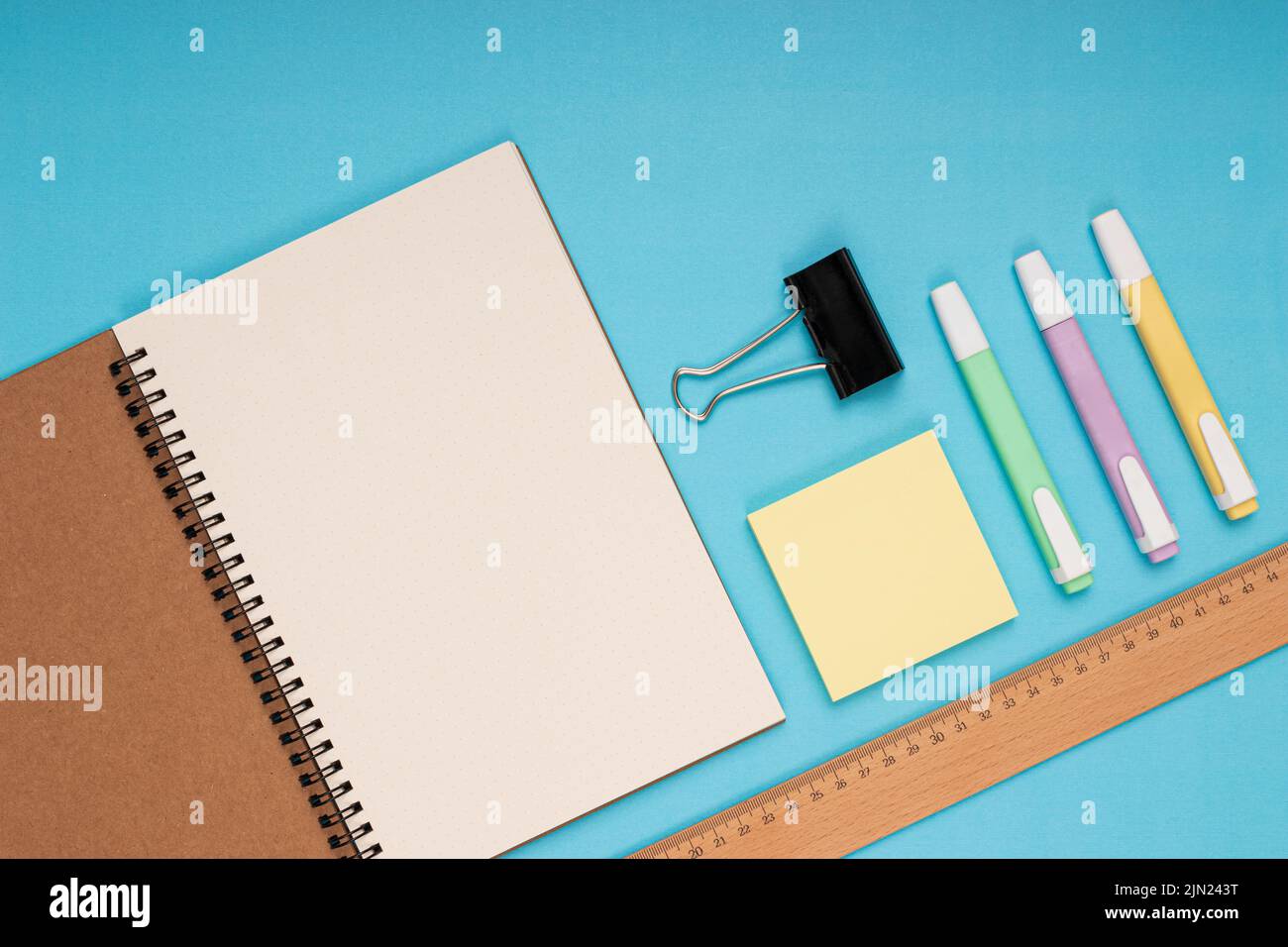 Notebook, colored pencils, ruler, note paper and clamp. back to school ...