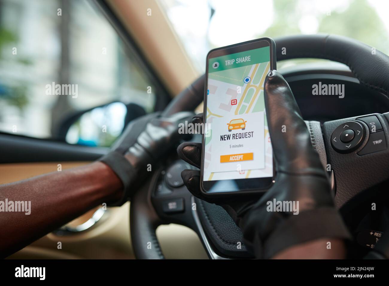 Closeup Image Of Driver Checking Requests In Car Sharing Application