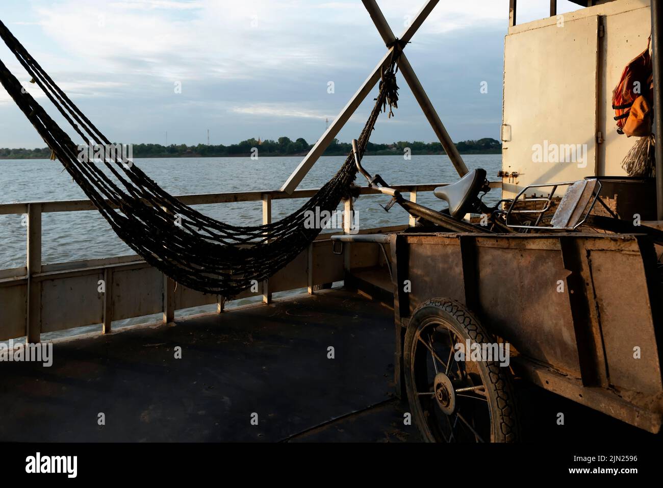 Ferry-boat taking cart with bicycle and hammock on the left Stock Photo ...