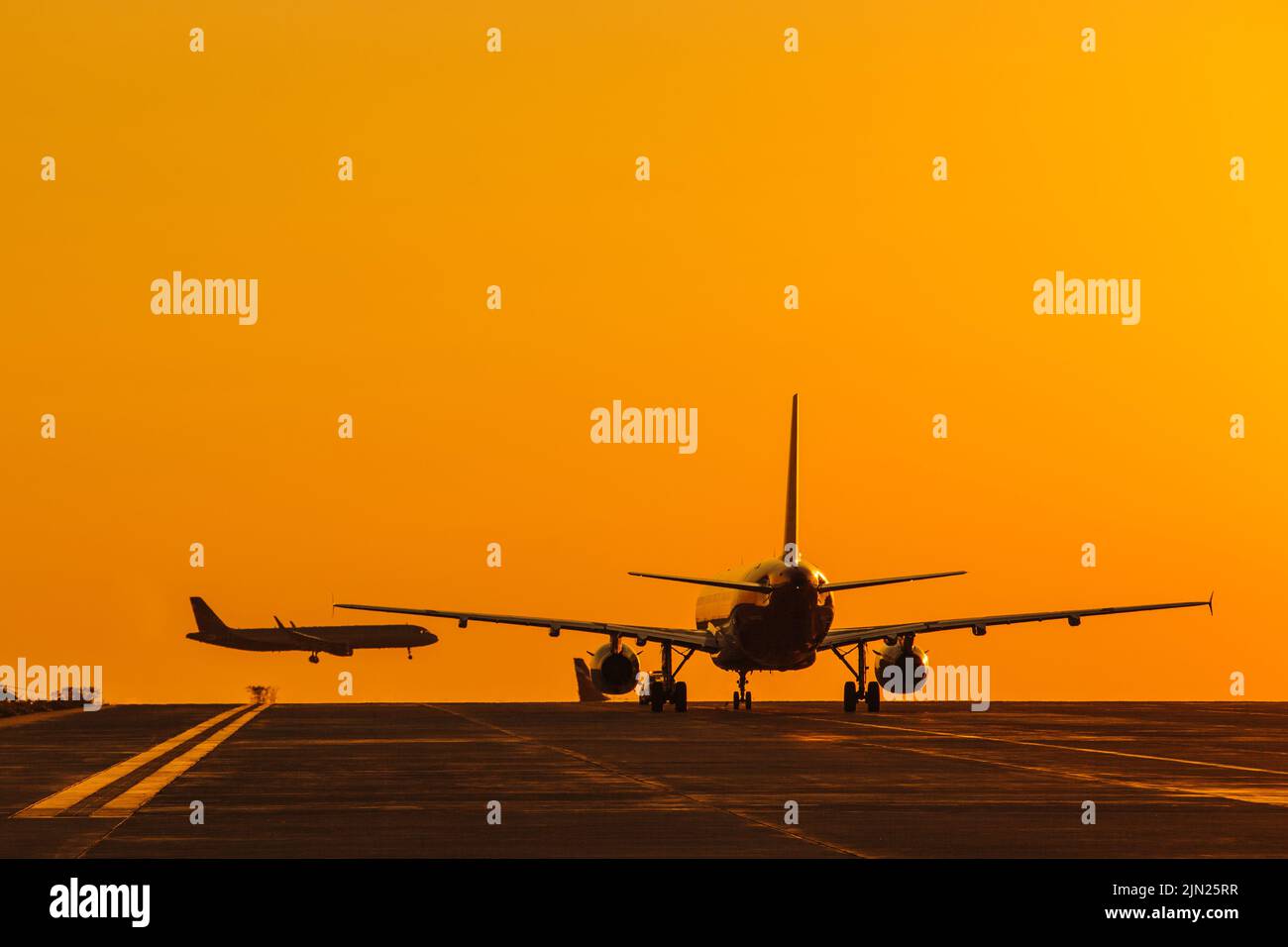 Passenger airplane take off from airport runway against the backdrop of ...