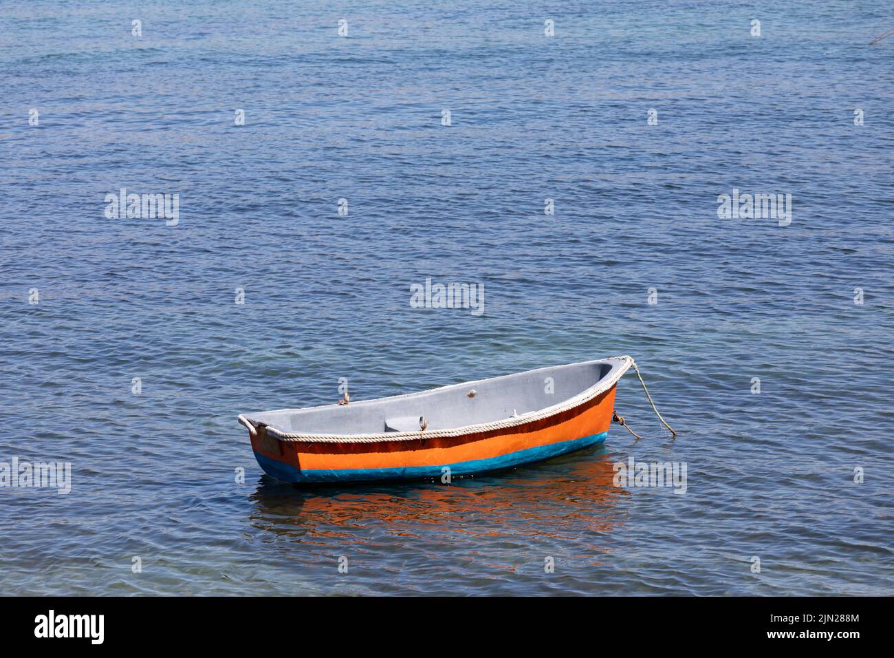 Small fishing boat floating in Swanage Bay, Dorset, England, UK Stock ...