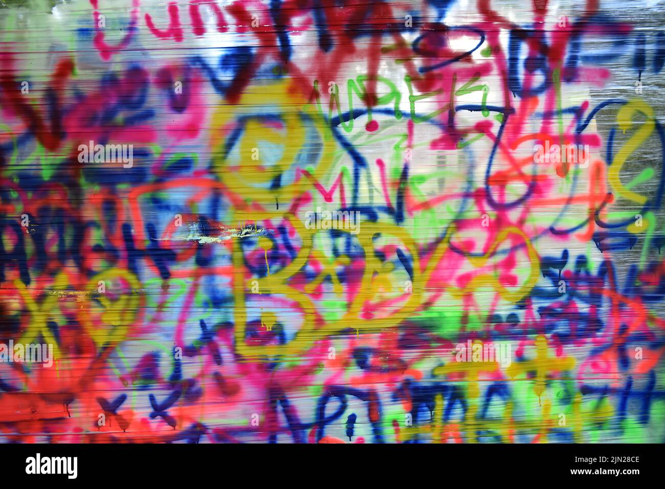 Children's drawings and coloring with paints on plastic wrapping paper ...