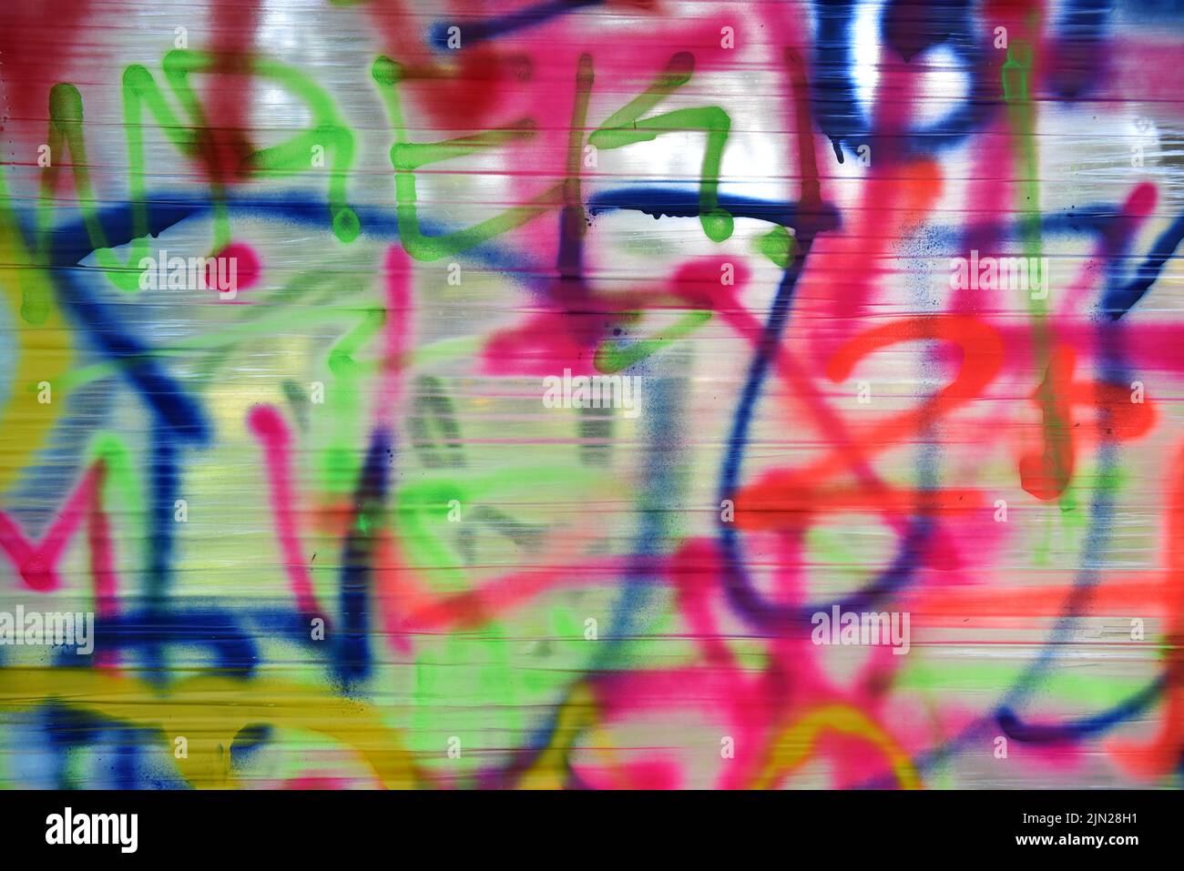 Children's drawings and coloring with paints on plastic wrapping paper ...