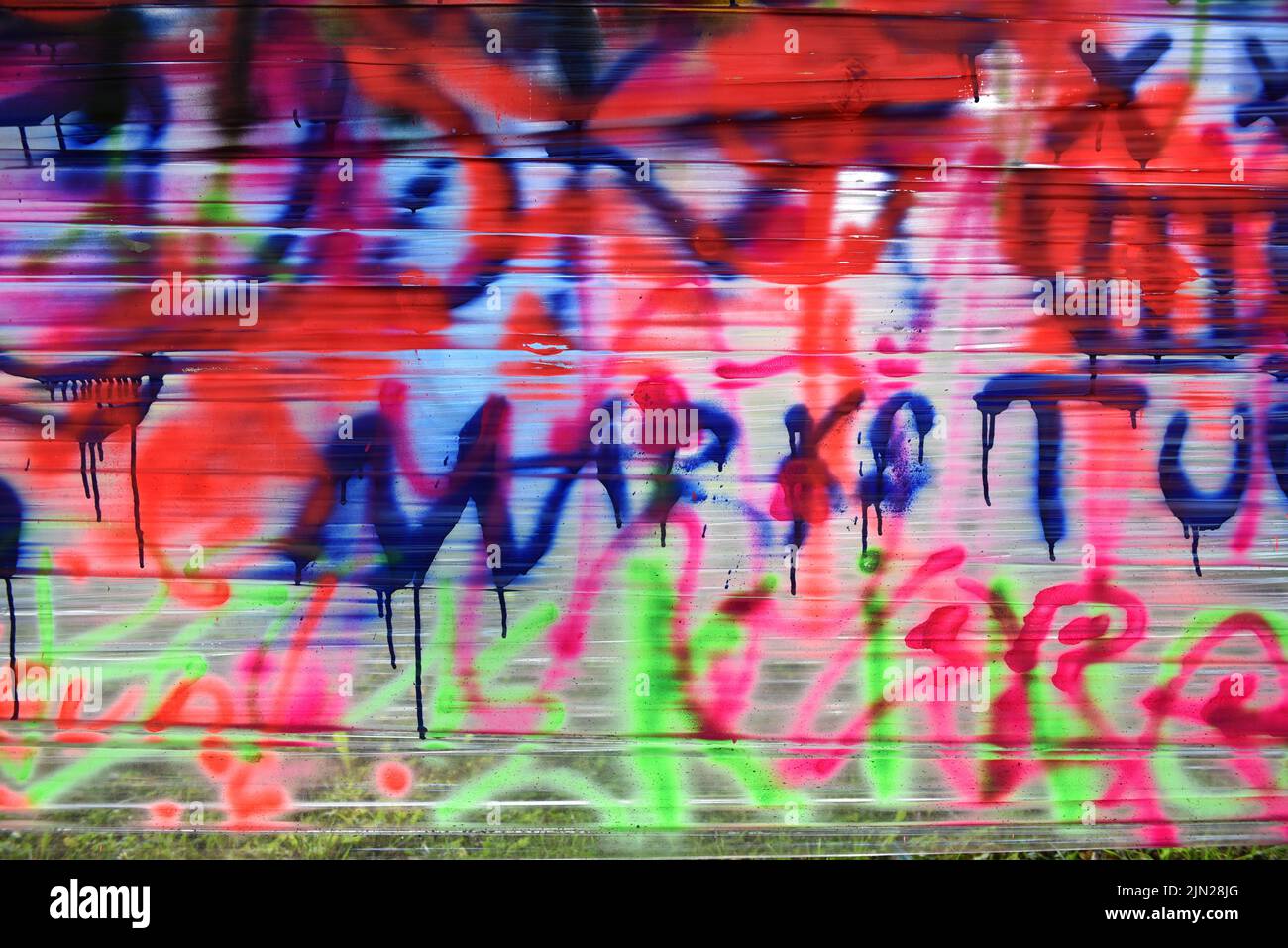 Children's drawings and coloring with paints on plastic wrapping paper ...
