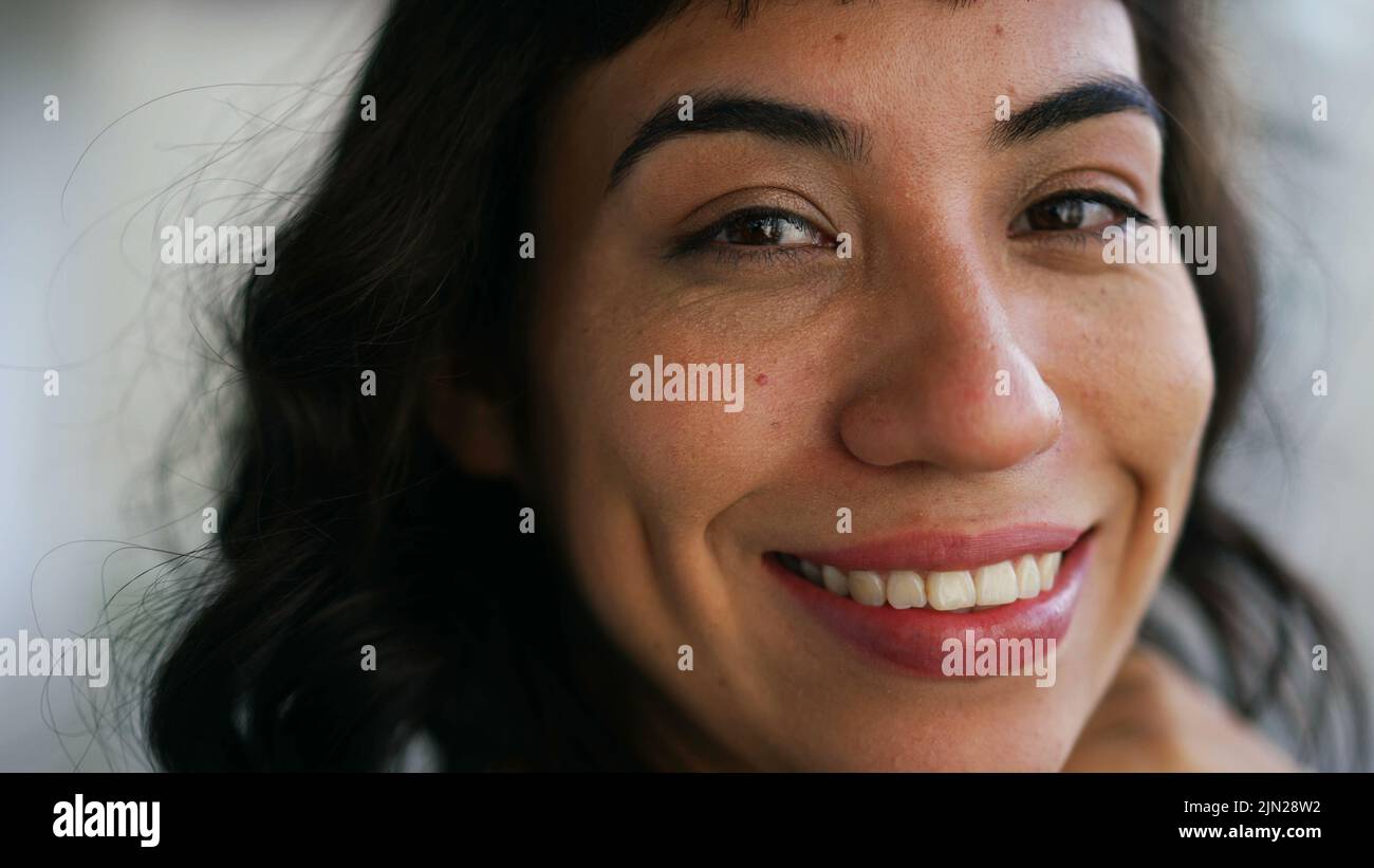One hispanic latin young woman closeup face smiling at camera. Portrait ...