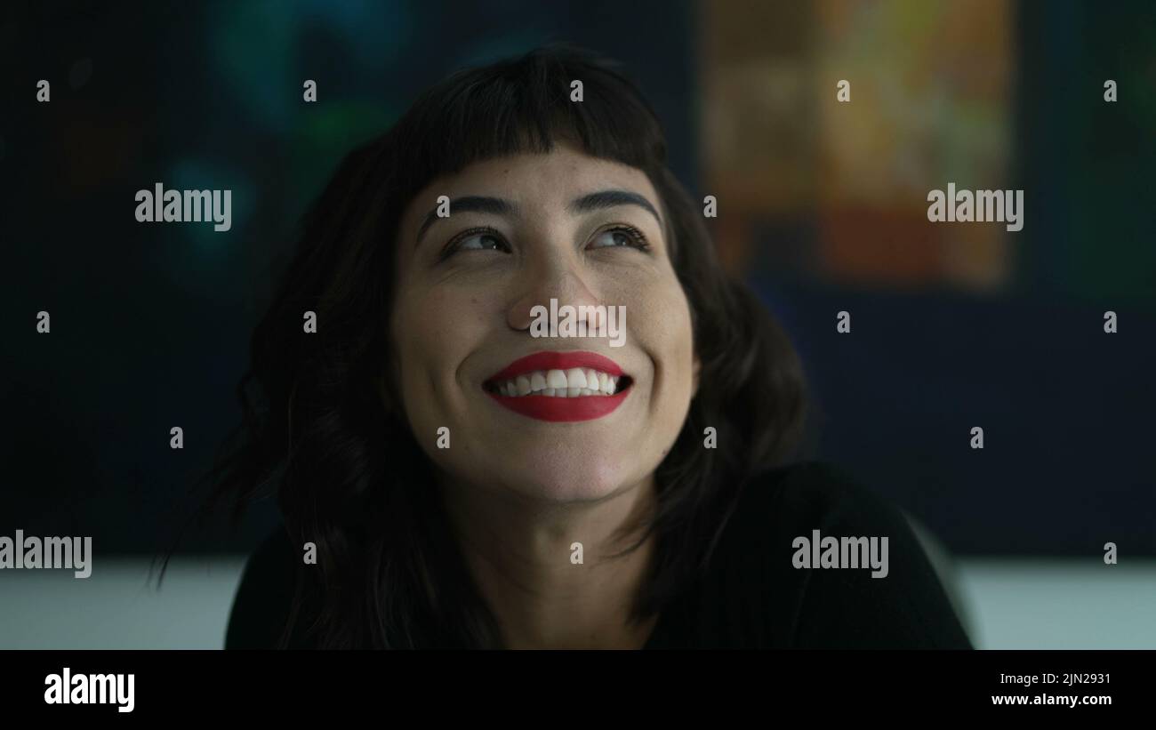 Portrait of a happy hispanic woman feeling hopeful and joy. One latin ...