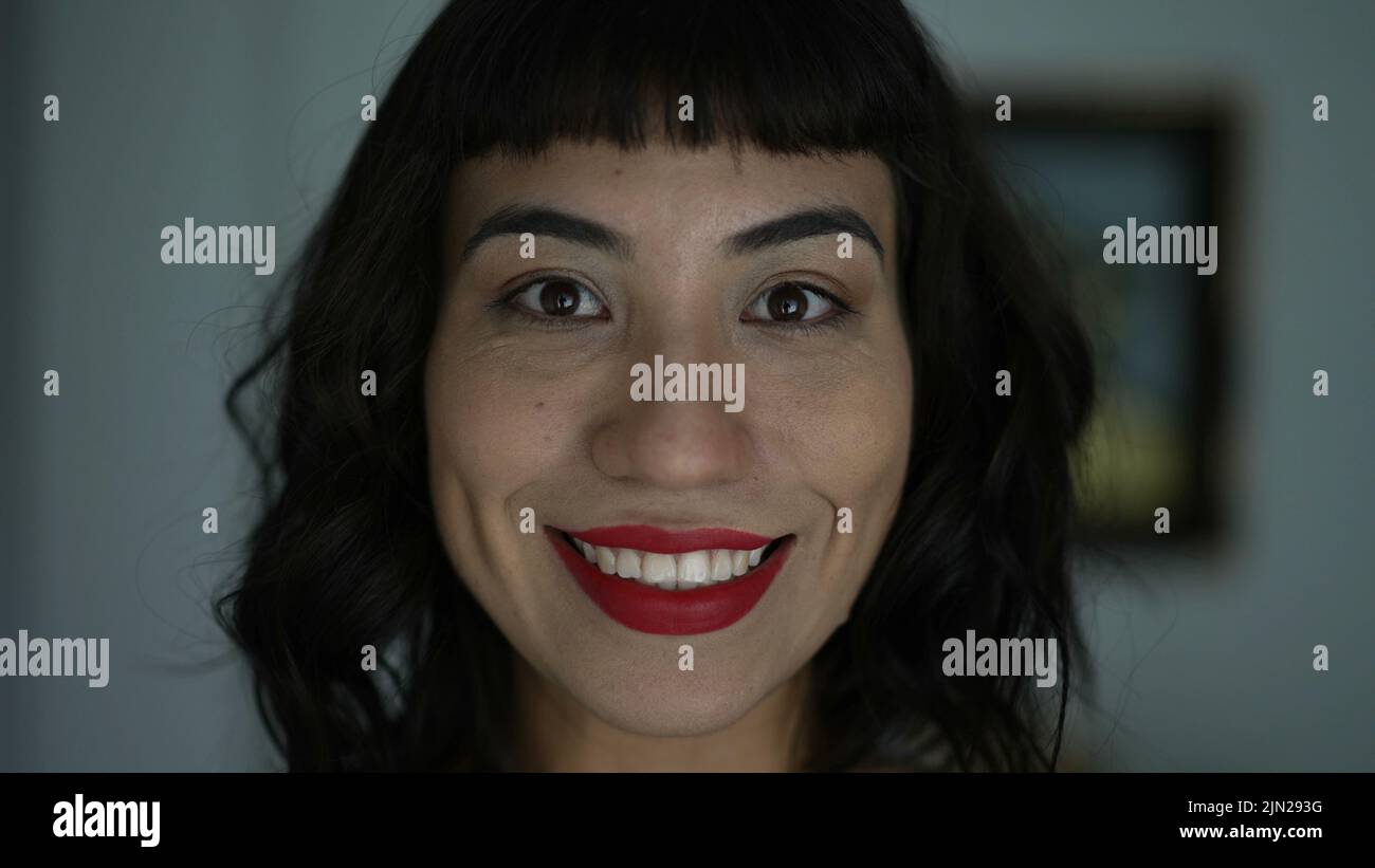 Portrait of a smiling Native American descent young woman. One latin ...