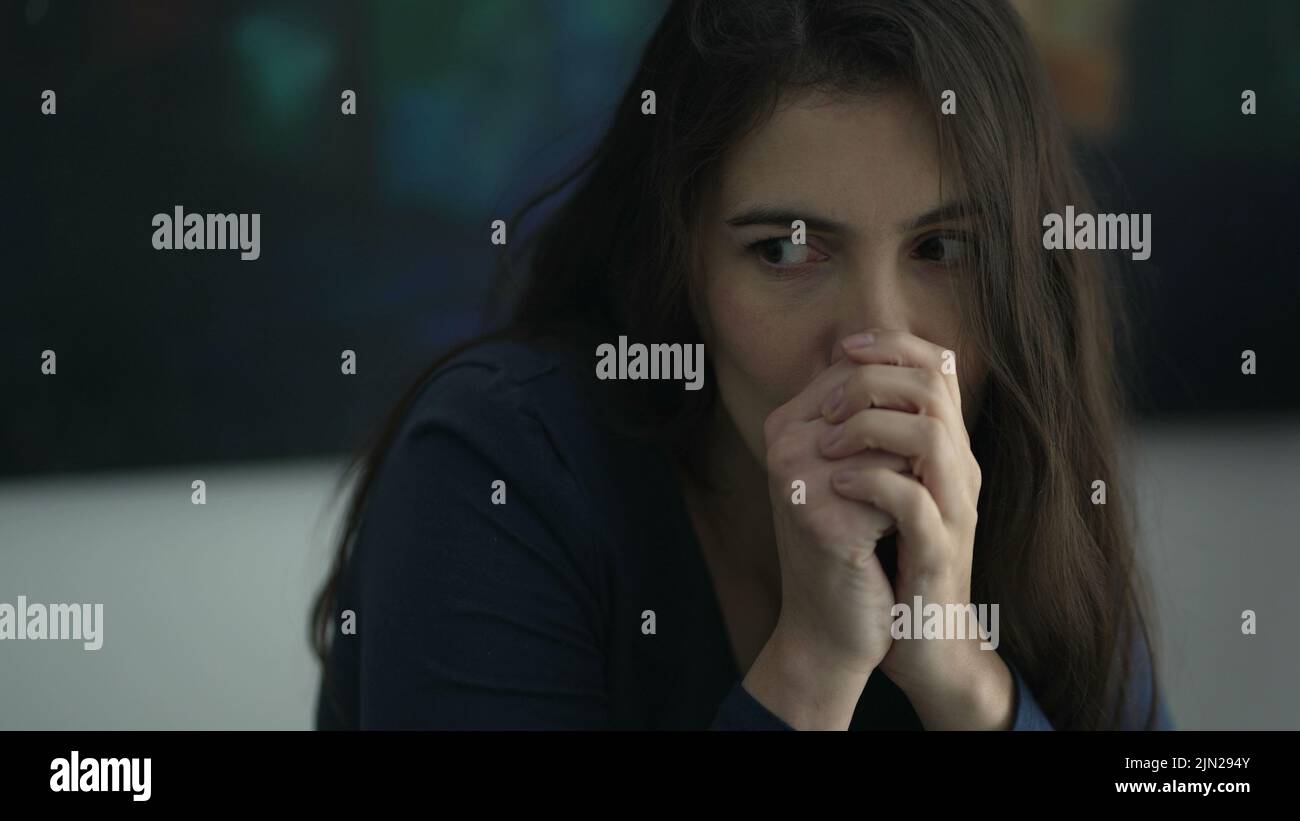 Fearful woman suffering emotional problems. One worried girl closing ...