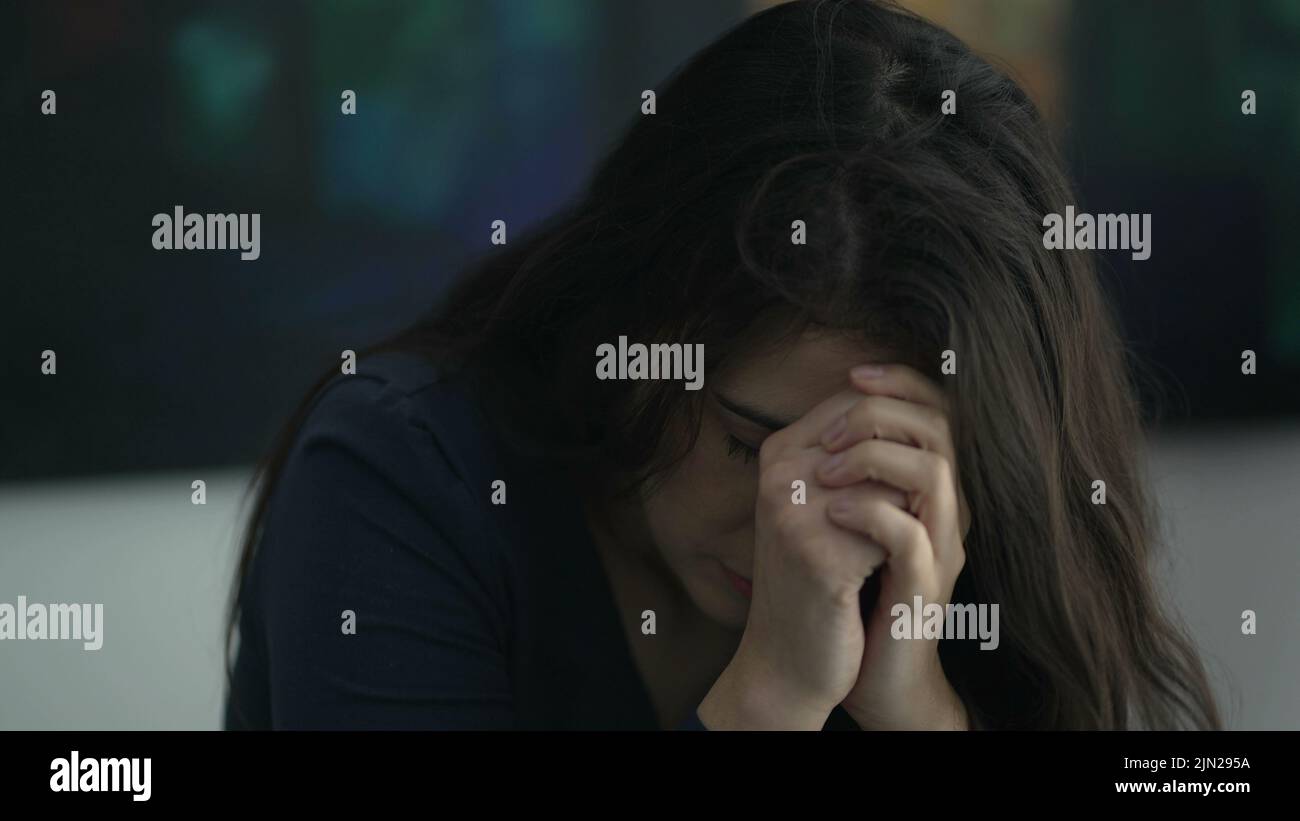 Fearful woman suffering emotional problems. One worried girl closing ...