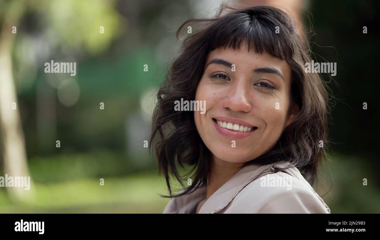 A hispanic woman with indigenous traits smiling at camera. Portrait ...