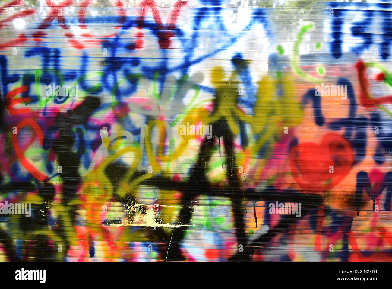 Children's drawings and coloring with paints on plastic wrapping paper ...