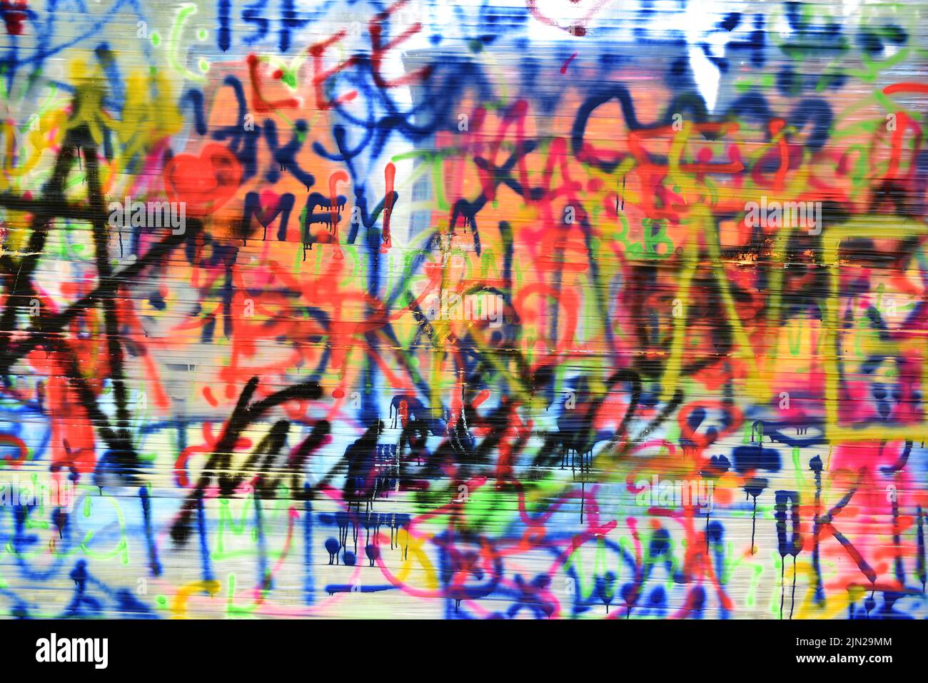 Children's drawings and coloring with paints on plastic wrapping paper ...