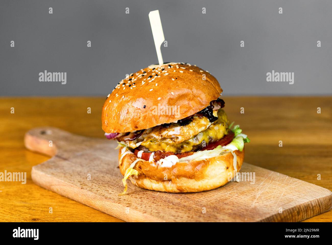 fresh tasty burger on table. bunhealthy fast food Stock Photo - Alamy