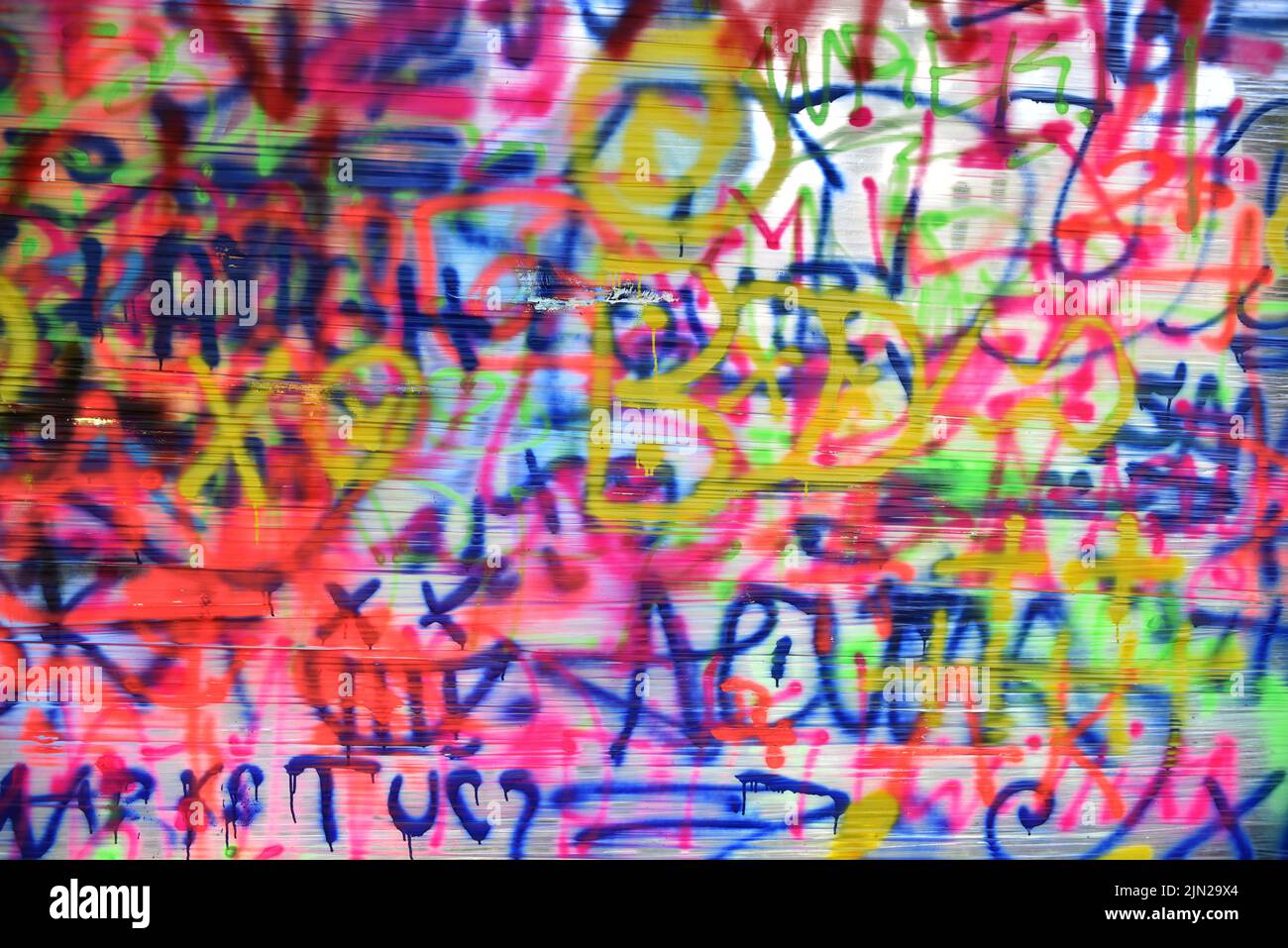 Children's drawings and coloring with paints on plastic wrapping paper ...