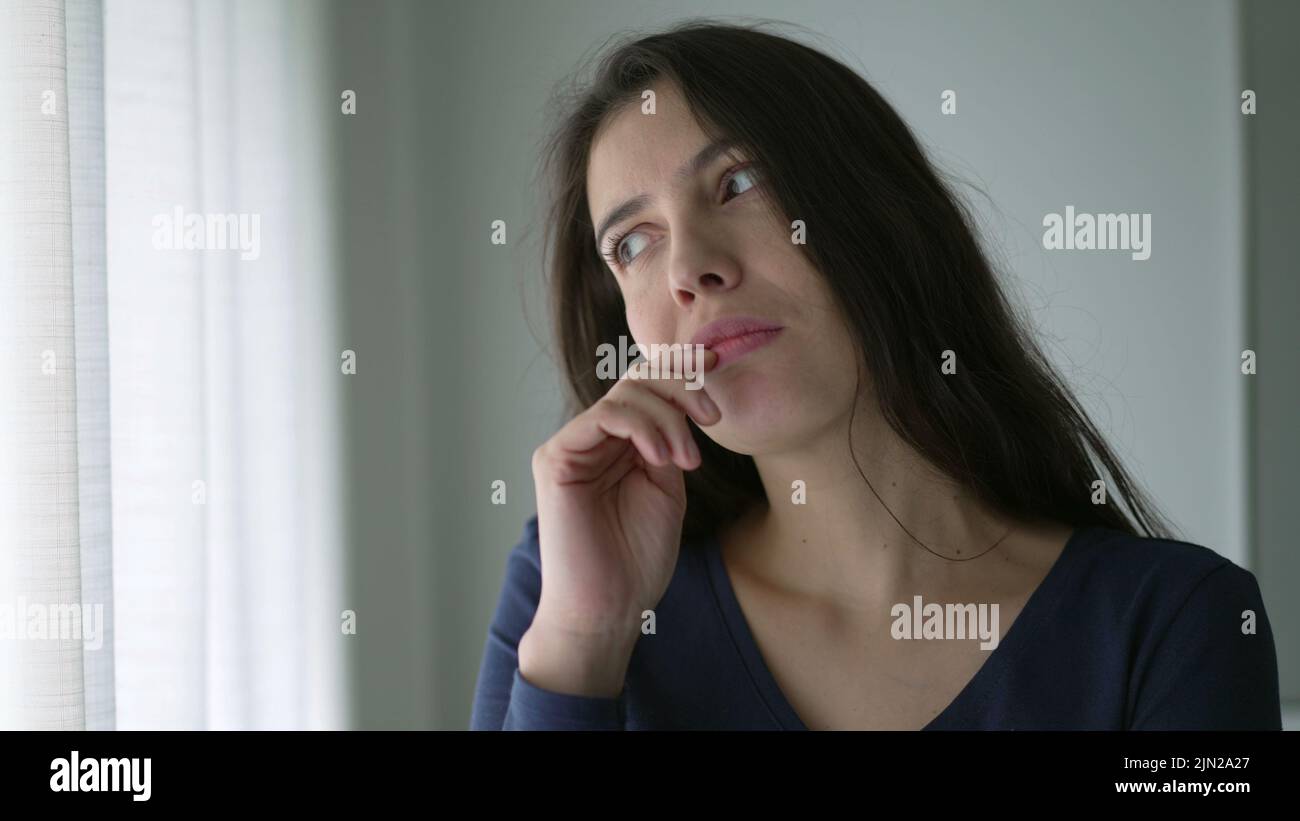 One confused woman thinking deeply about solution. Person in dilemma ...