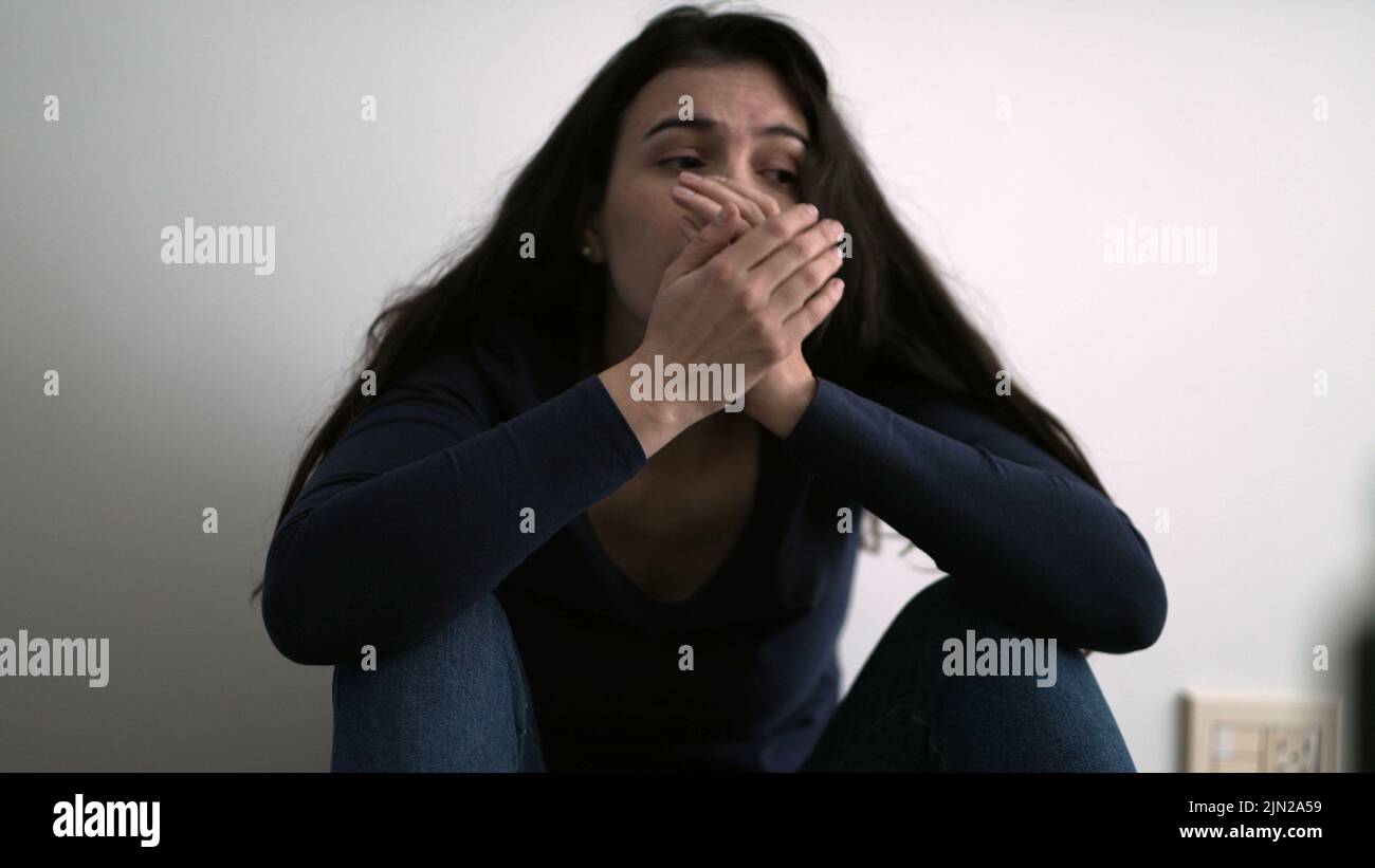 Woman covering face with shame suffering of mental illness. Person ...