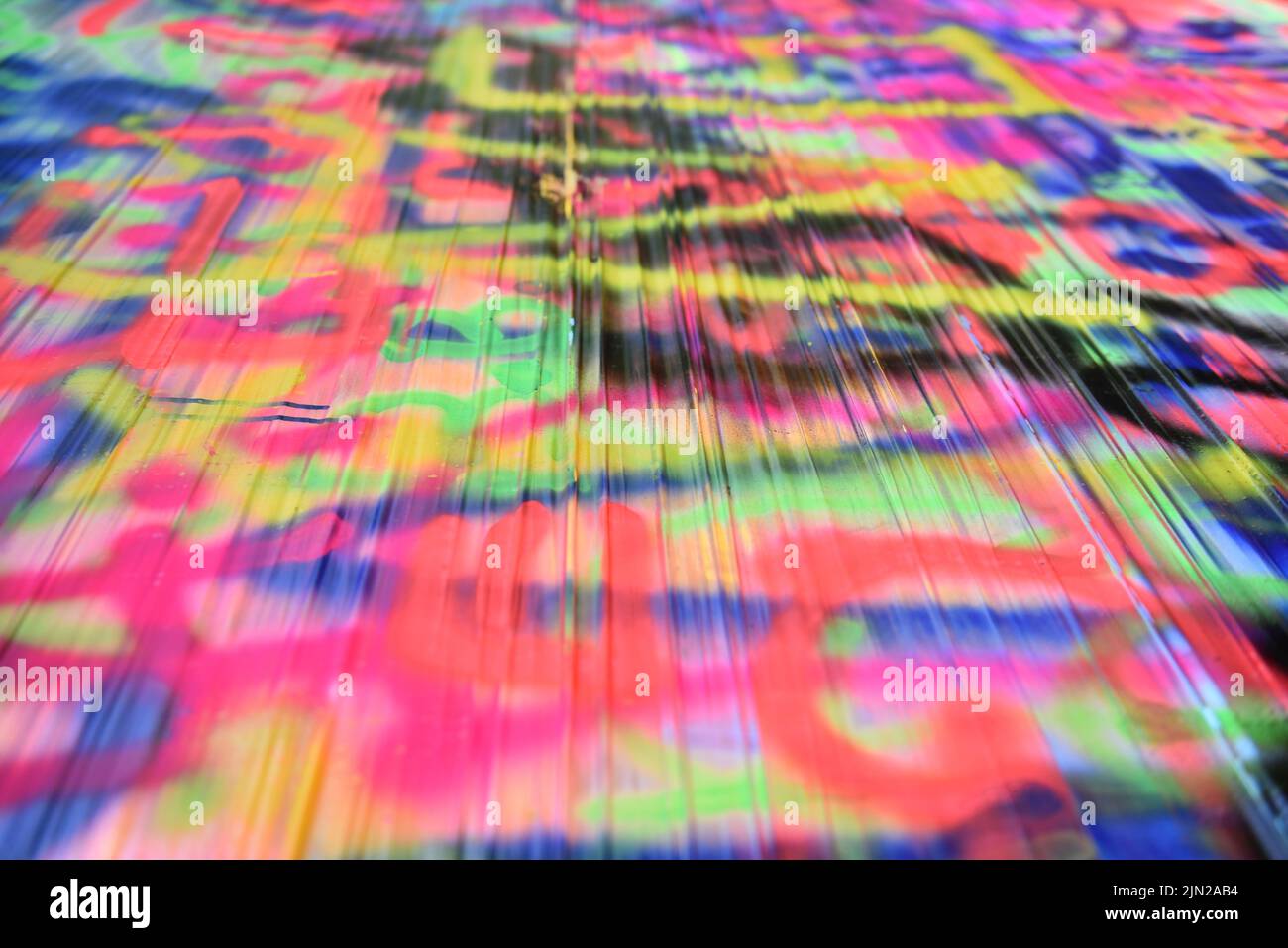 Children's drawings and coloring with paints on plastic wrapping paper ...